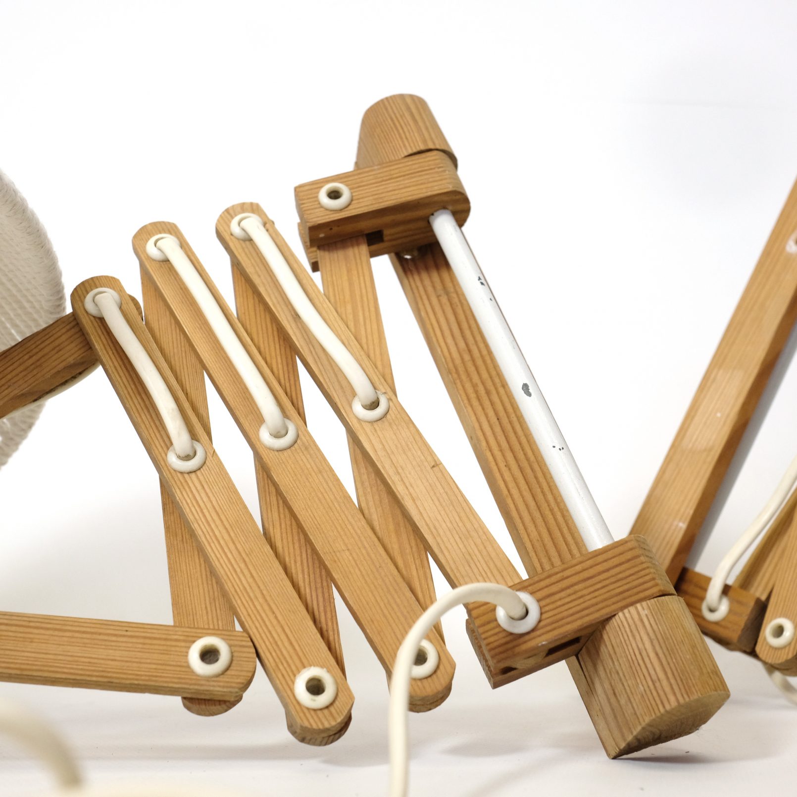 Pair of wooden wall mounted scissor lamps with cotton shades. — LampAndCo